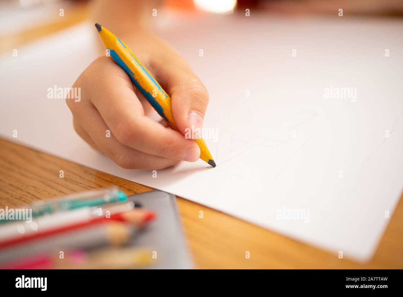 child drawing with color pencils, back to school Stock Photo - Alamy