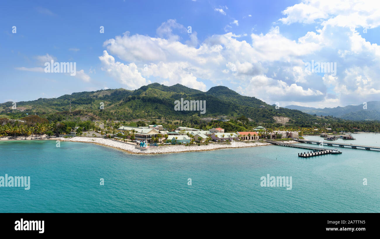 Panorama of tropical island with port and resort Stock Photo - Alamy