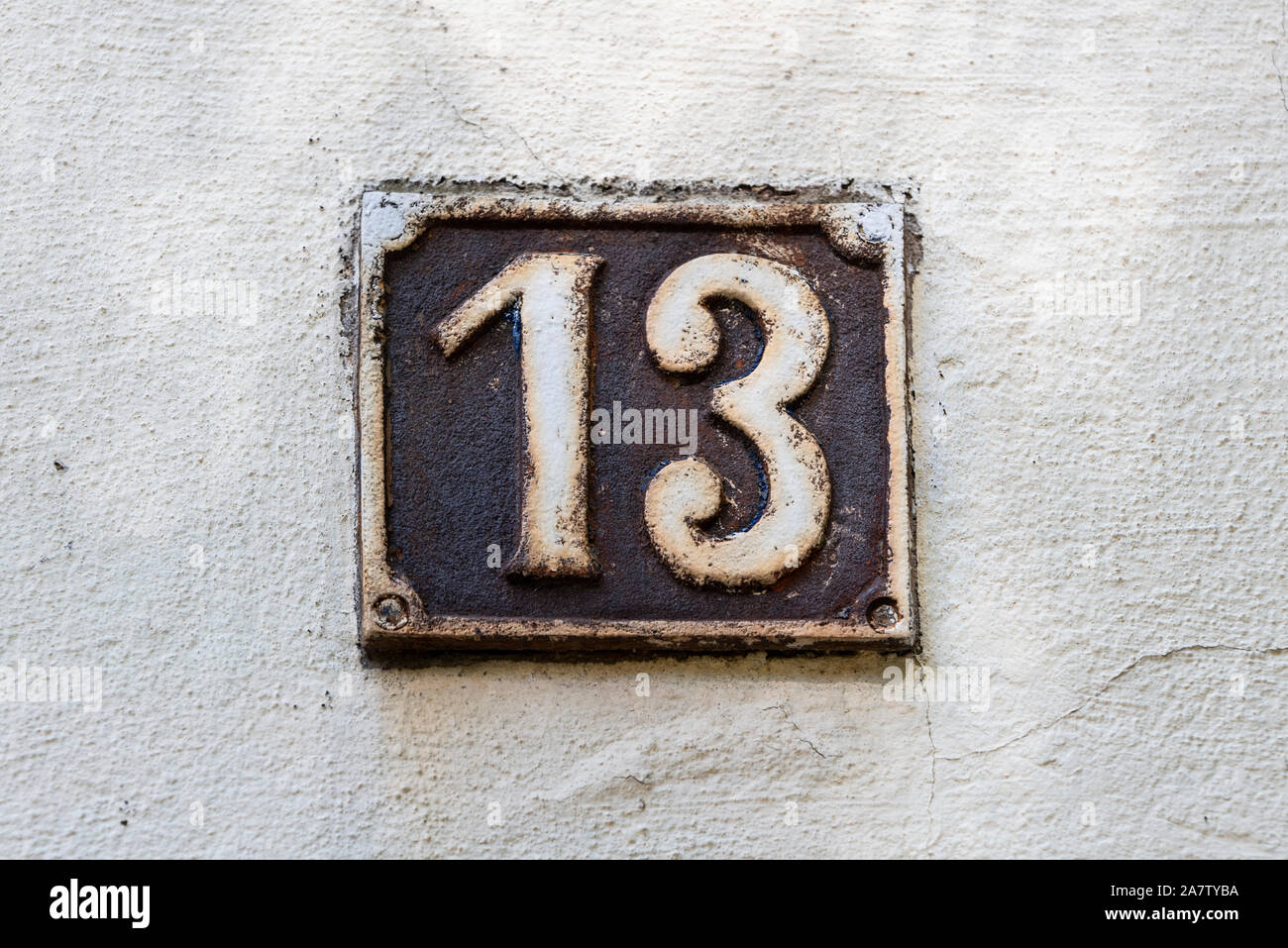 Street number sign on the wall Stock Photo - Alamy