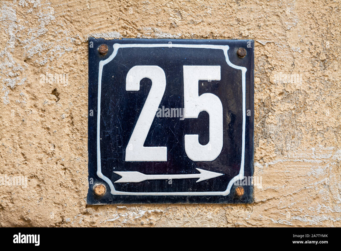 Street number sign on the wall Stock Photo - Alamy