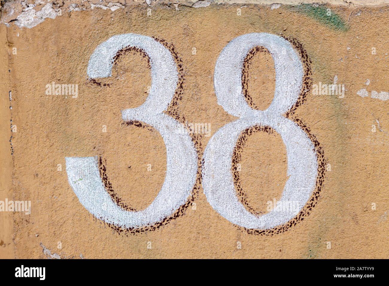 Street number sign on the wall Stock Photo - Alamy