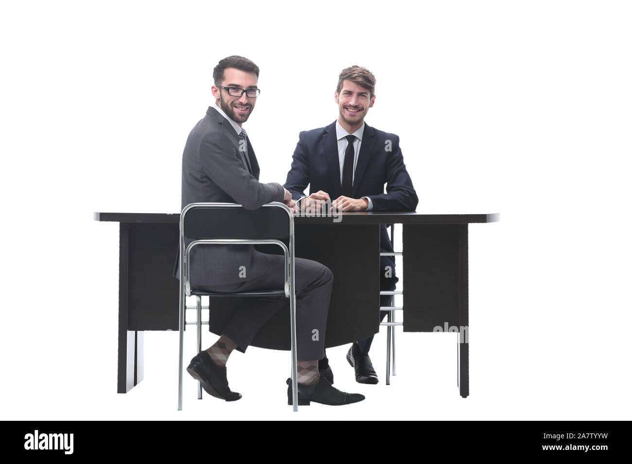 two business people talking sitting at a Desk Stock Photo - Alamy
