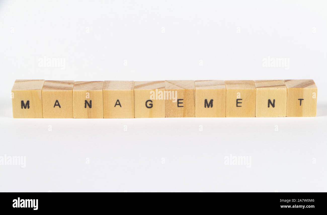 Management written with wooden cubes on white background Stock Photo ...