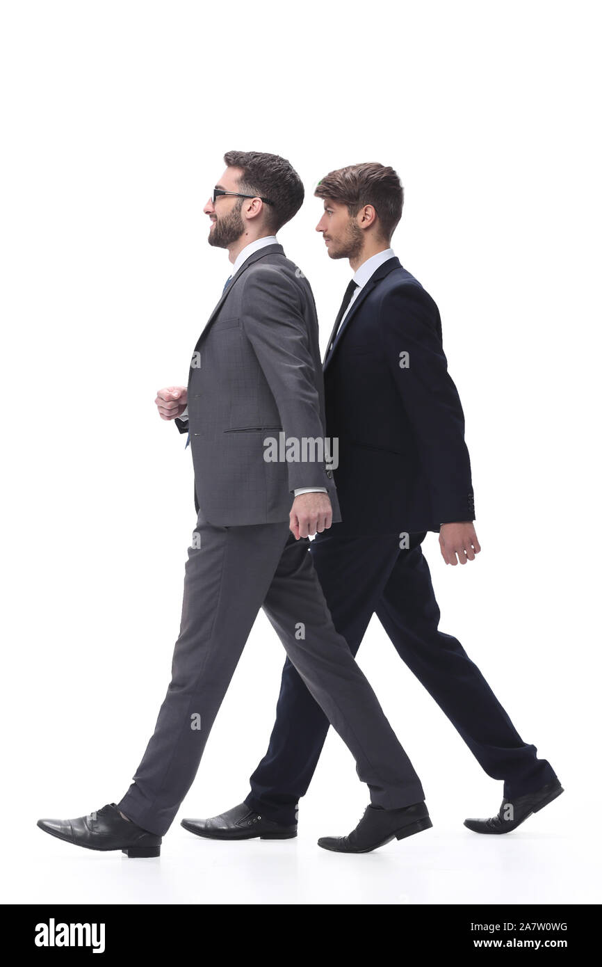 Two businessmen walking side by side hi-res stock photography and ...