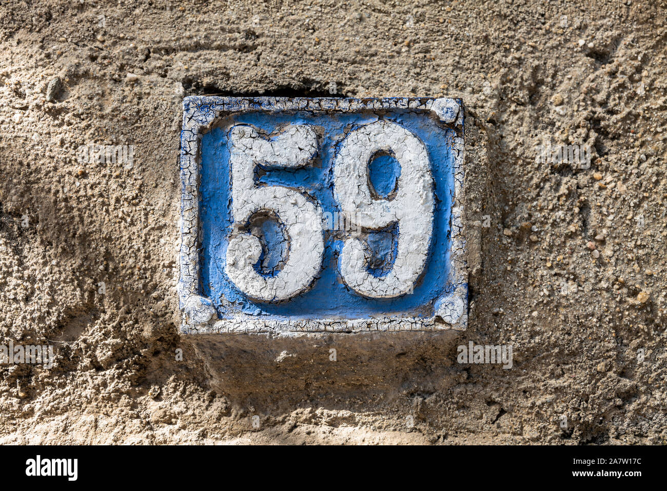Street number sign on the wall Stock Photo - Alamy