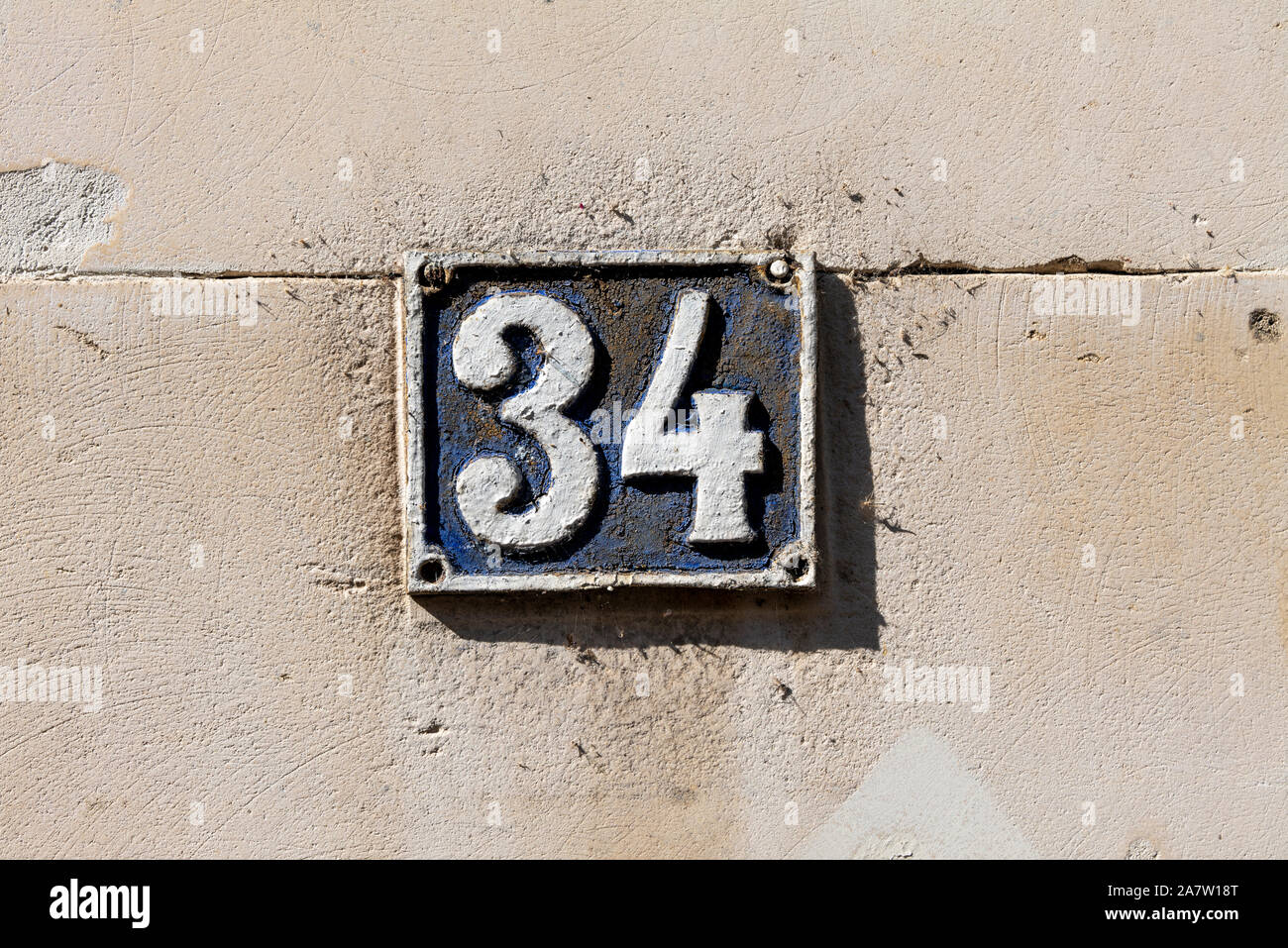Street number sign on the wall Stock Photo - Alamy
