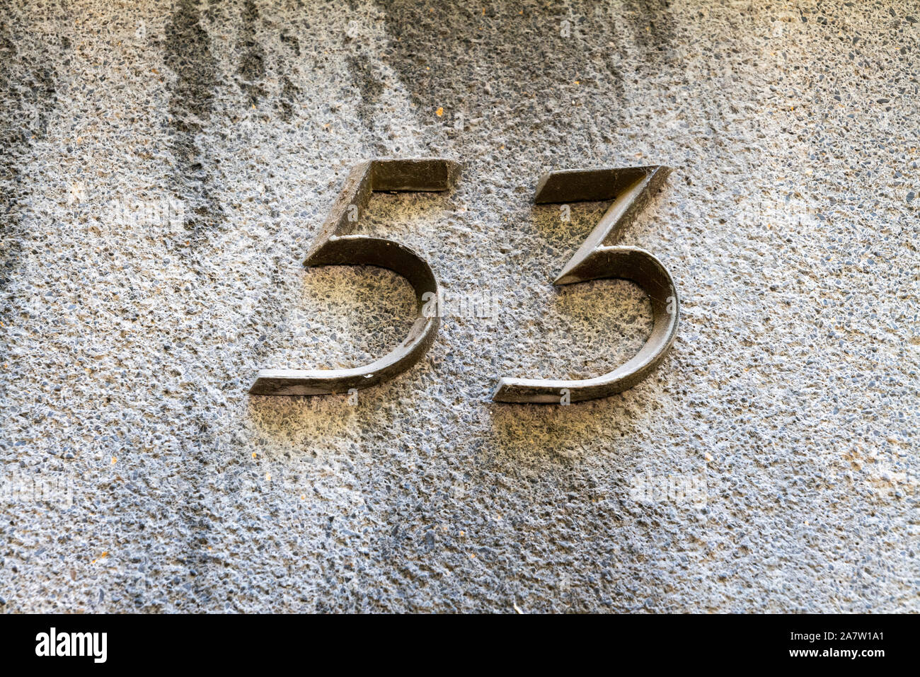 Street number sign on the wall Stock Photo - Alamy