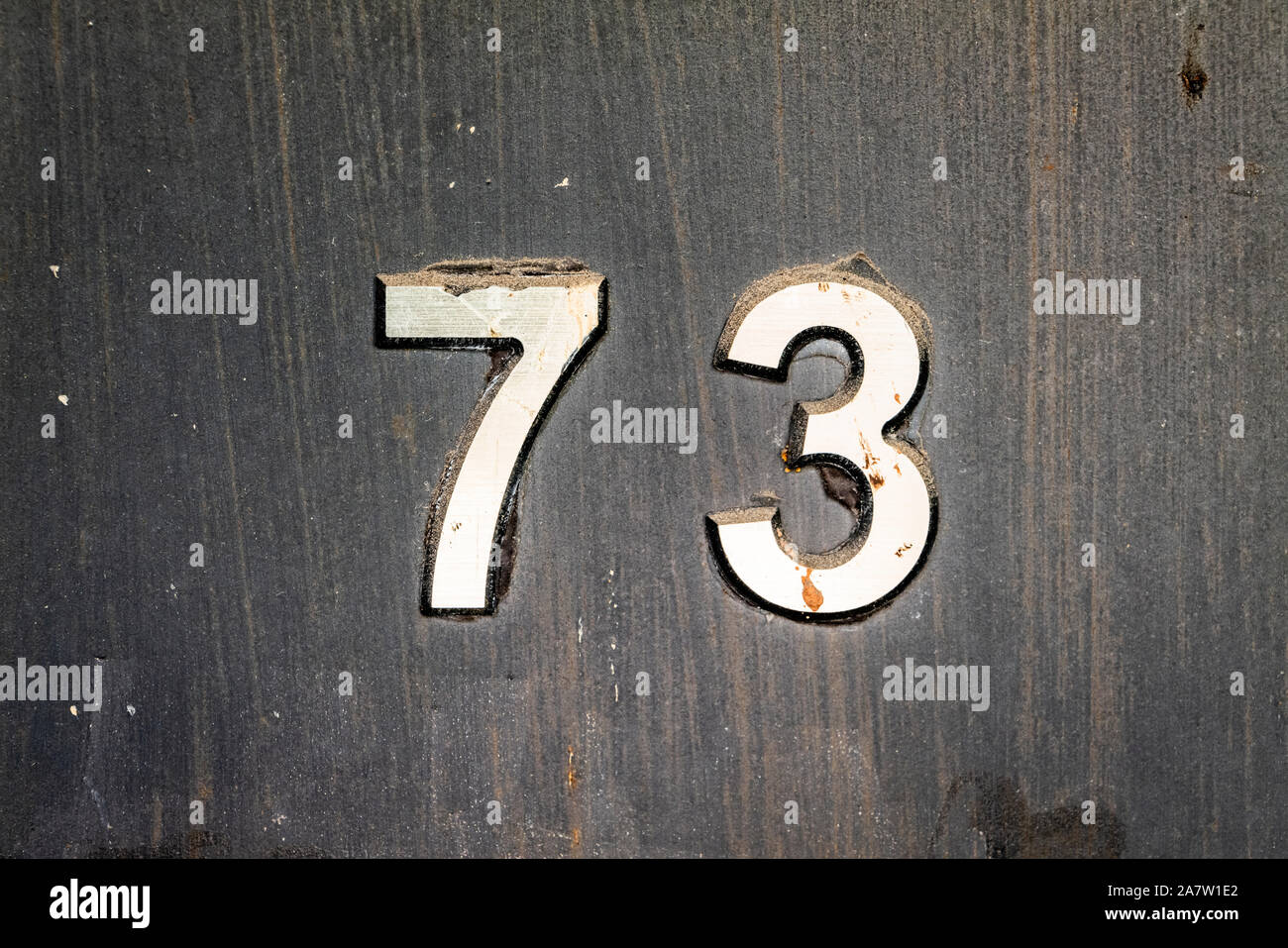 Street number sign on the wall Stock Photo - Alamy