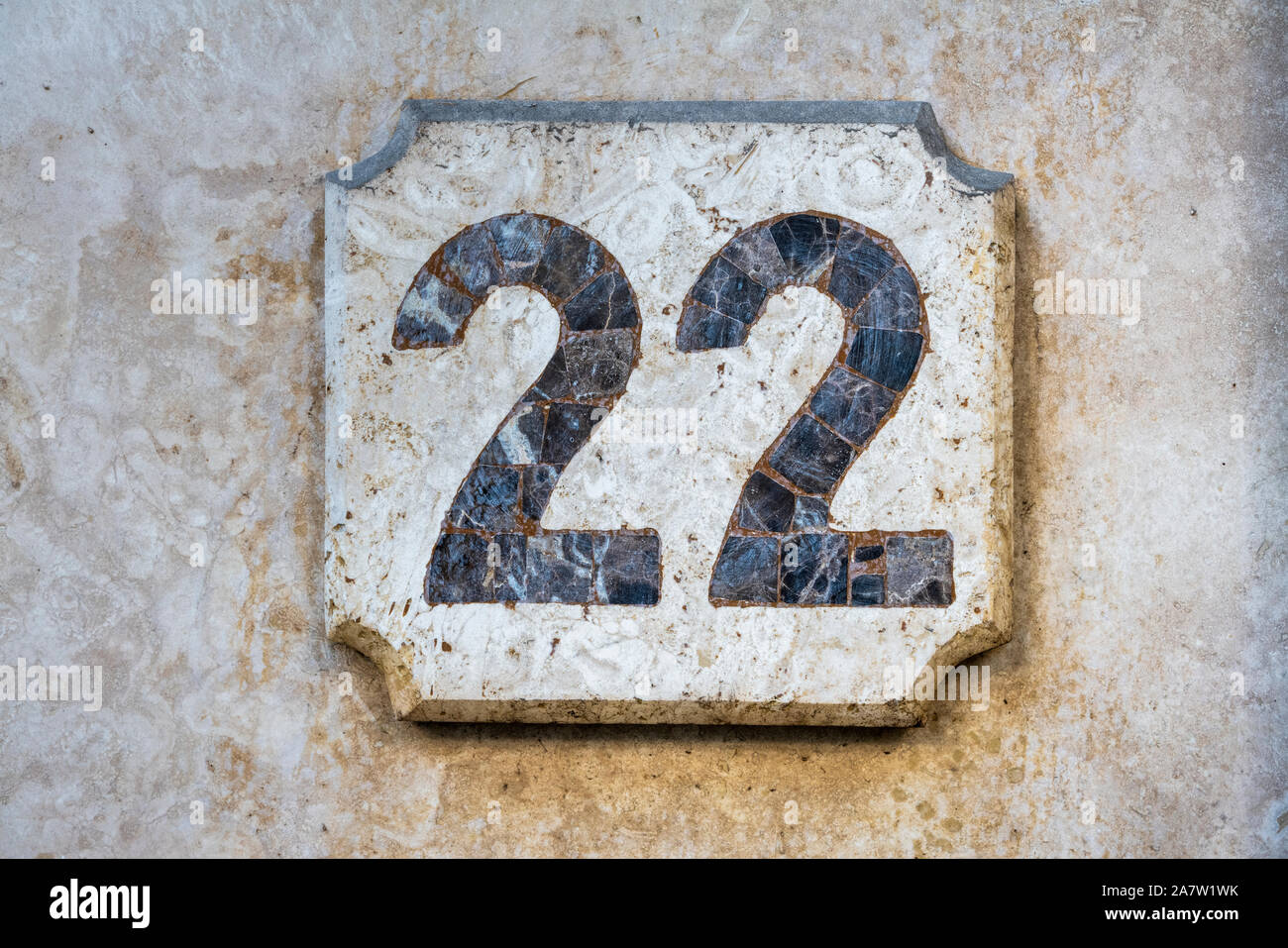 Street number sign on the wall Stock Photo - Alamy