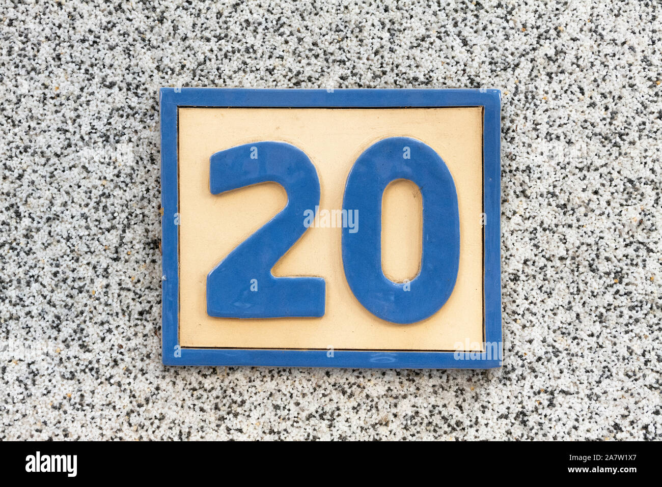 Street number sign on the wall Stock Photo - Alamy