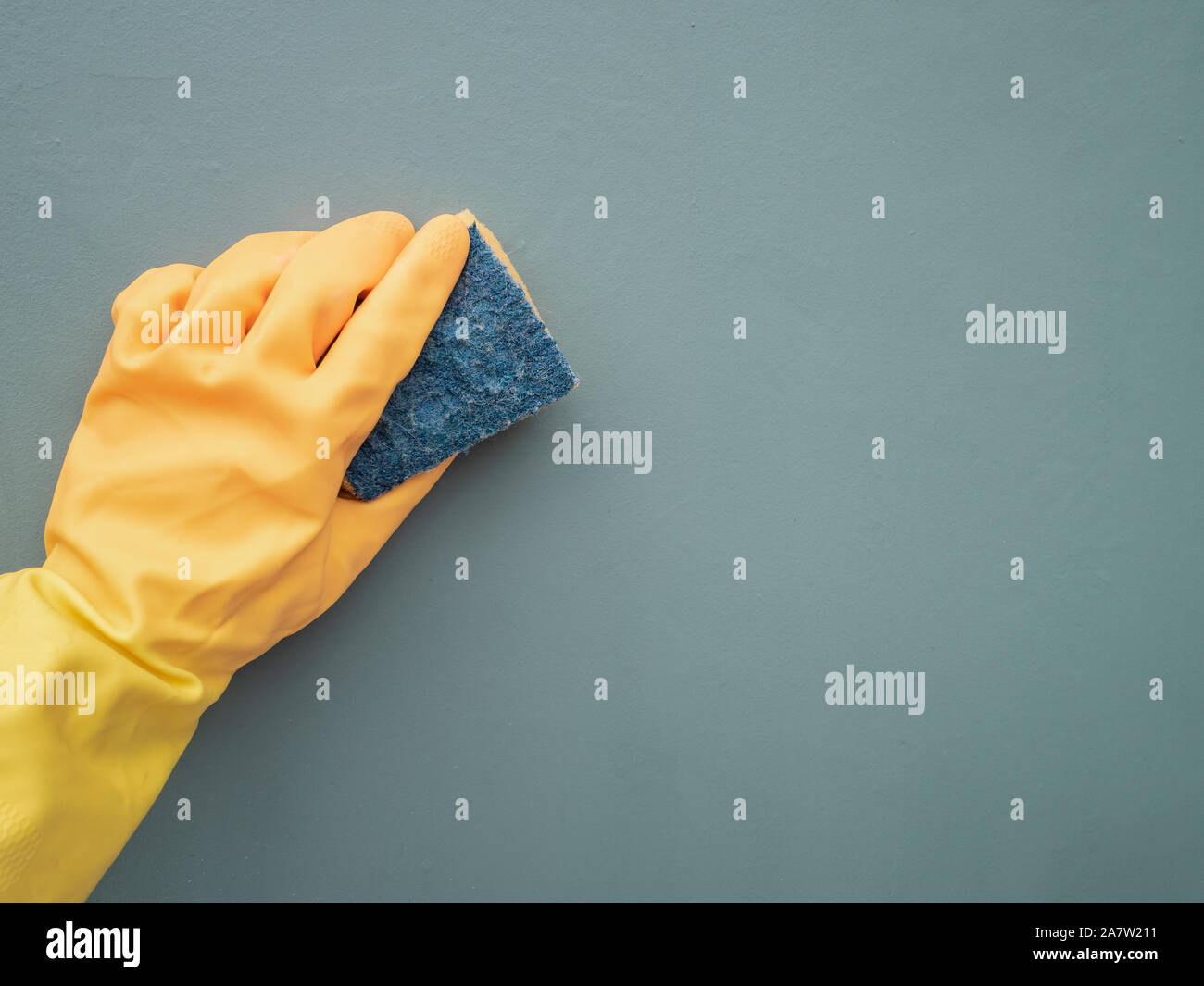 Hand wearing green rubber hi-res stock photography and images - Alamy