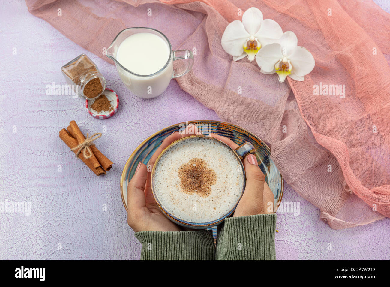 Girl's hand hold Traditional Turkish Drink Salep. Turkish salep (milky ...