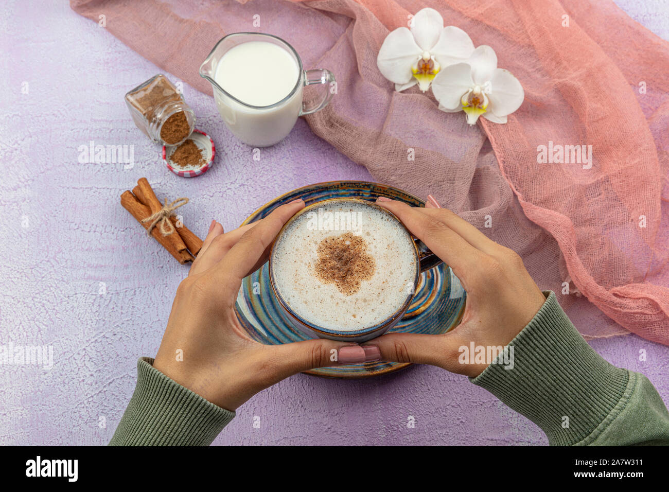 Girl's hand hold Traditional Turkish Drink Salep. Turkish salep (milky ...