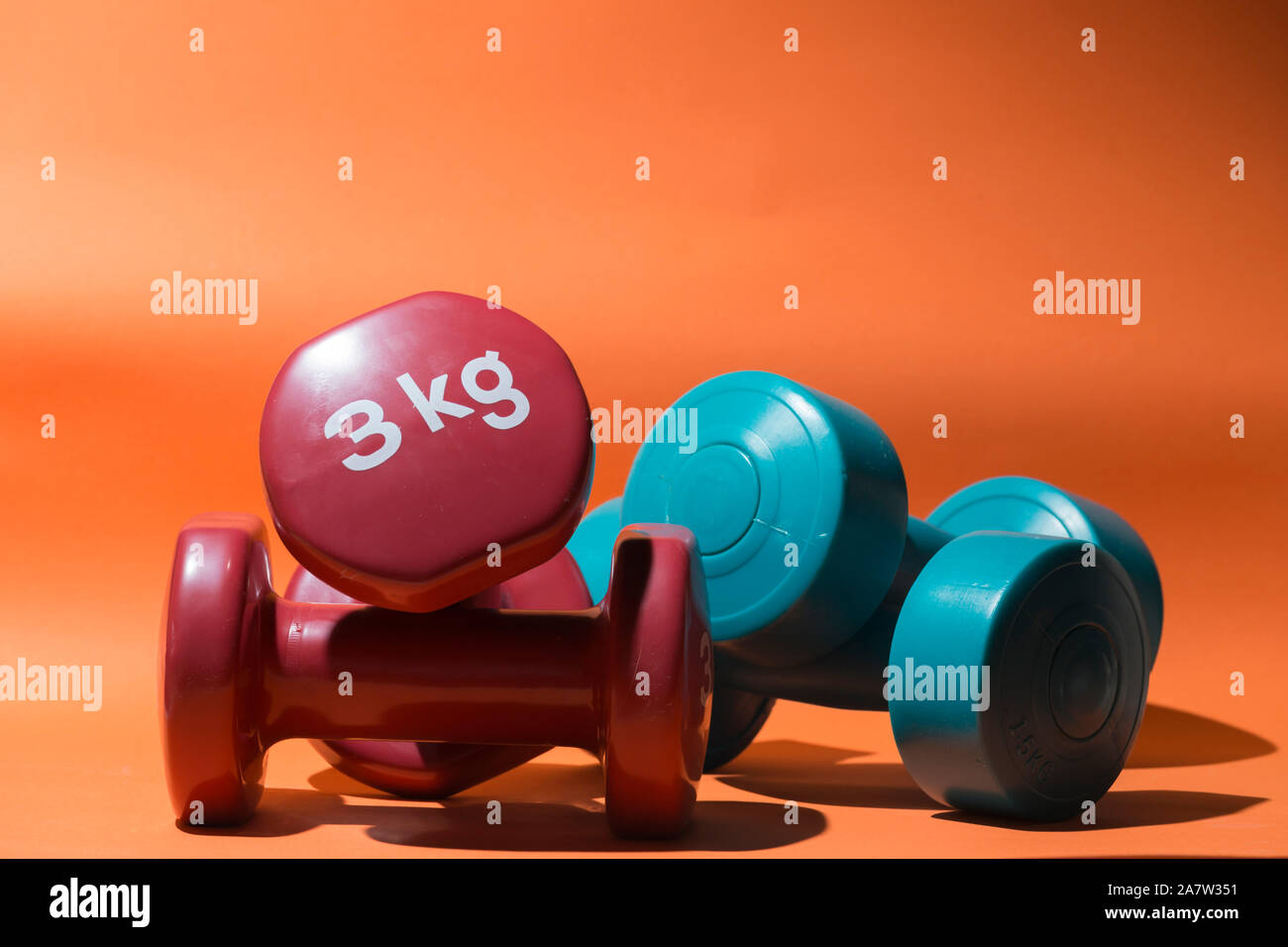 view of two red and two blue weights with different weight, placed on ...