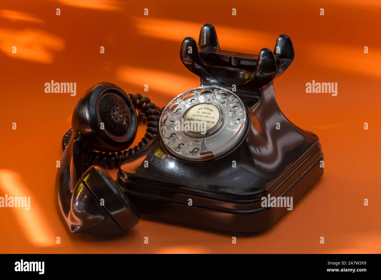 classic telephone, dial or roulette dial, off-hook and placed on an ...