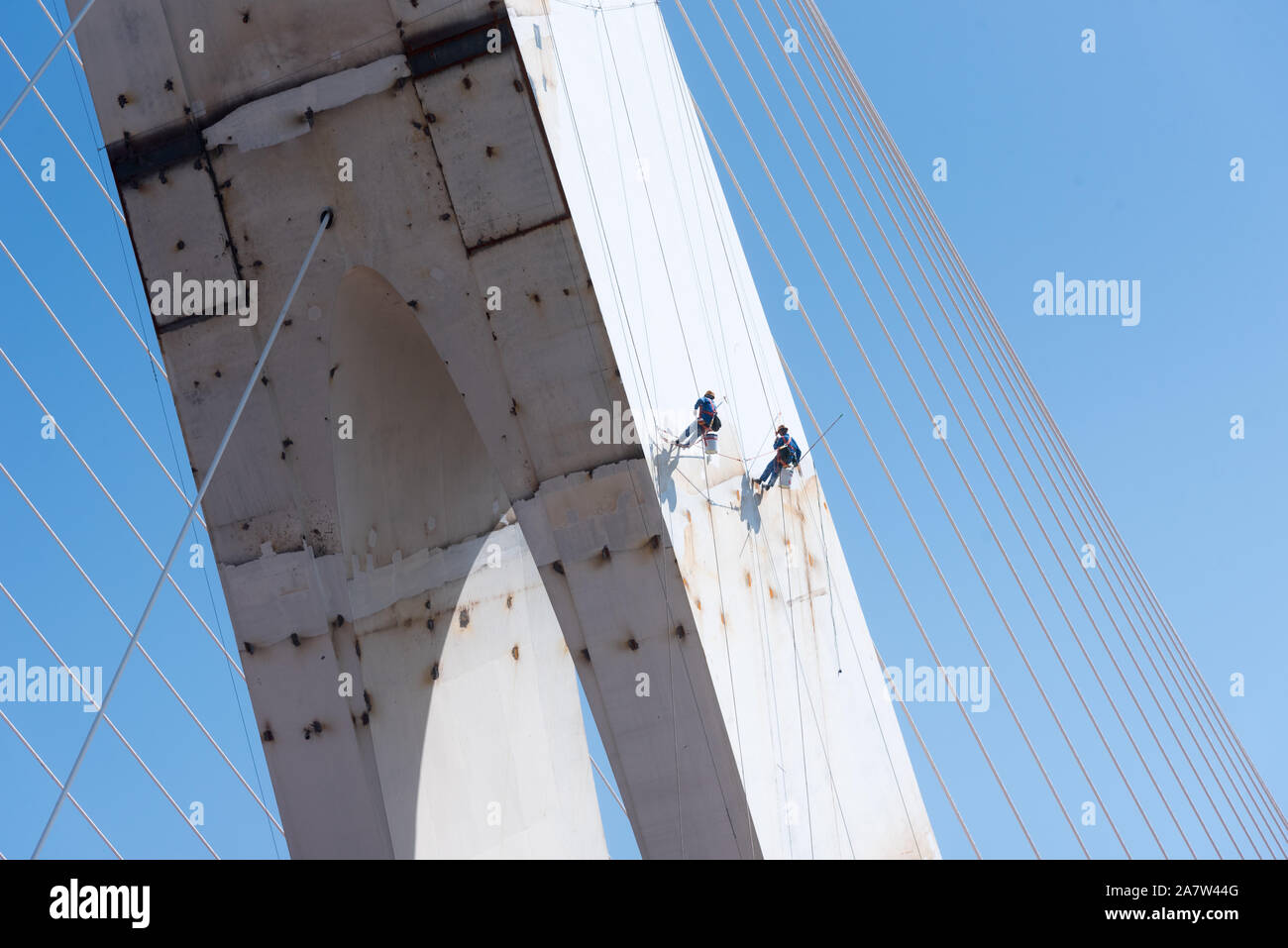 Construction workers work on the pillars of the New Beijing Shougang ...