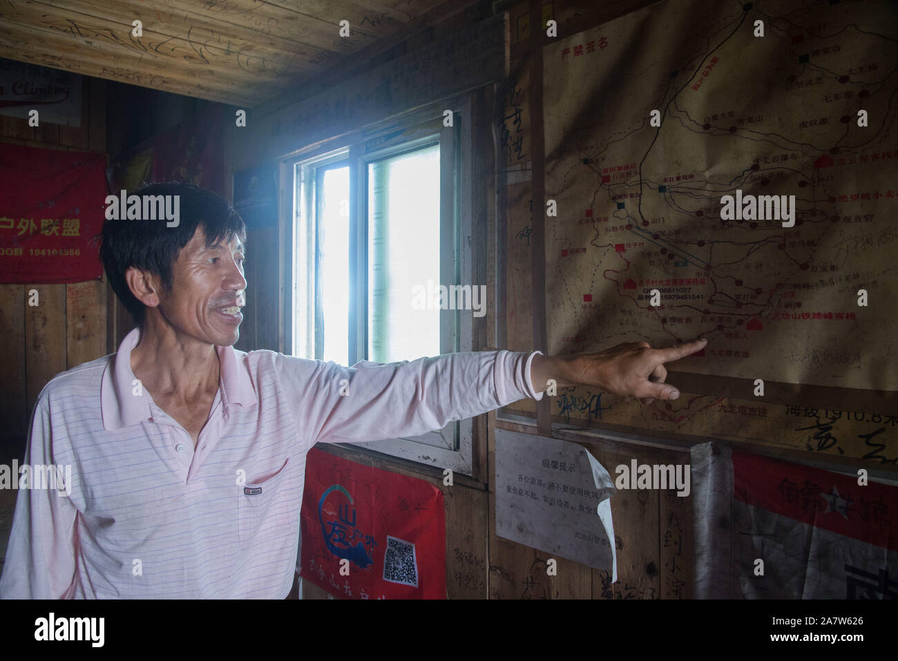 Lin shows his hotel in a map in Luxi county, Pingxiang city, east China ...