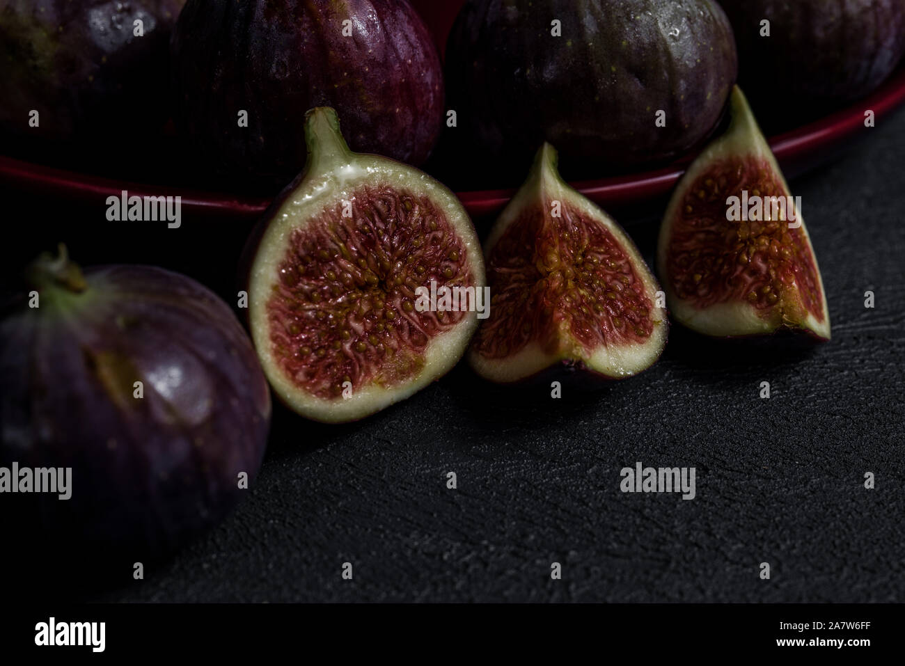 fresh figs close-up on black background. dark moody photo Stock Photo ...
