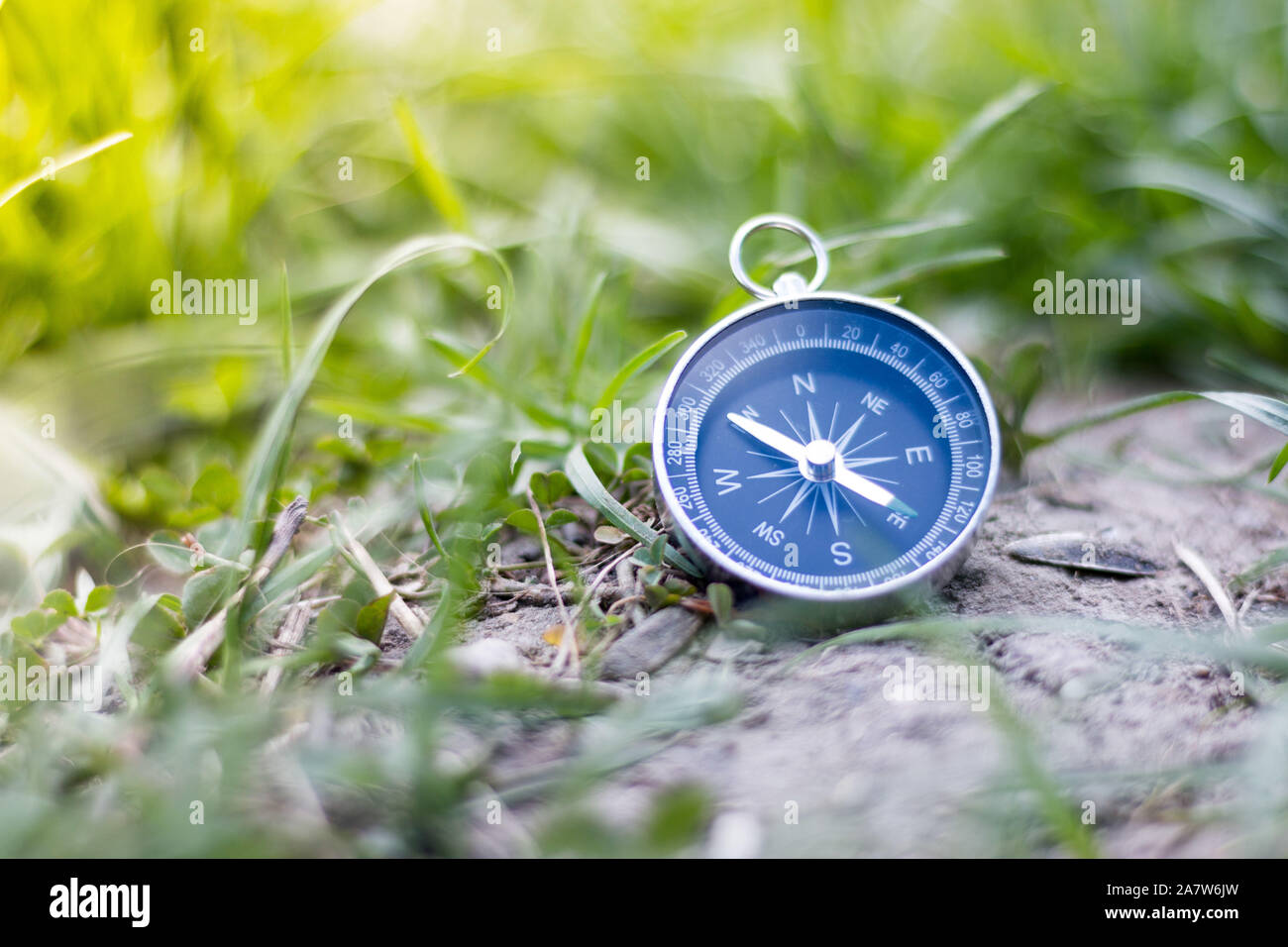 Vintage compass lying on the floor. Adventure and discovery concept ...