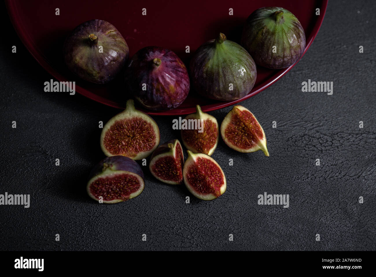fresh figs close-up on black background. dark moody photo Stock Photo ...