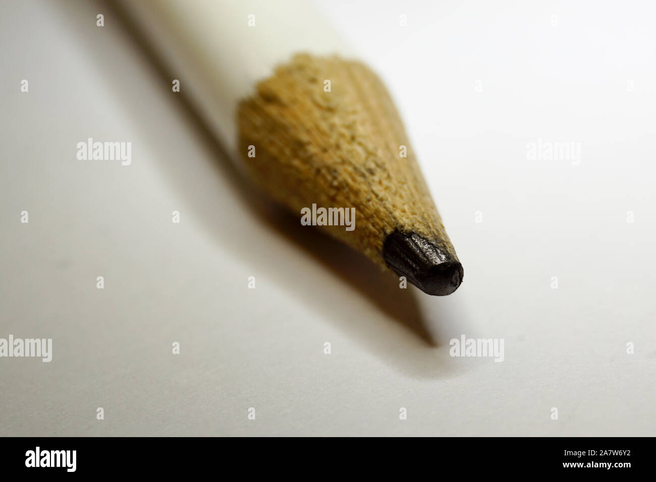 Realistic close-up of office tool graphite pencil worn tip in partial ...