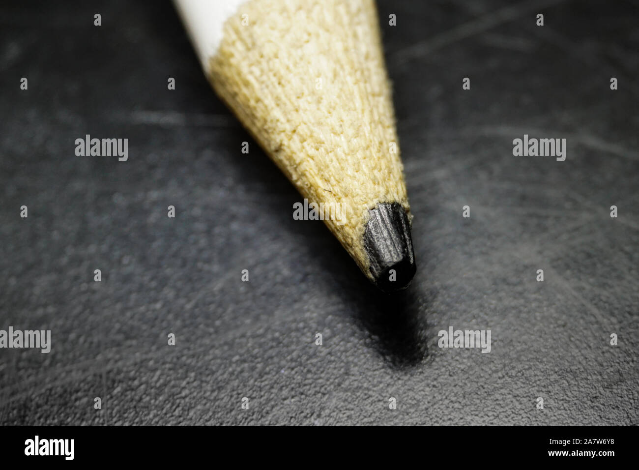 Realistic close-up of office tool graphite pencil worn tip in partial ...