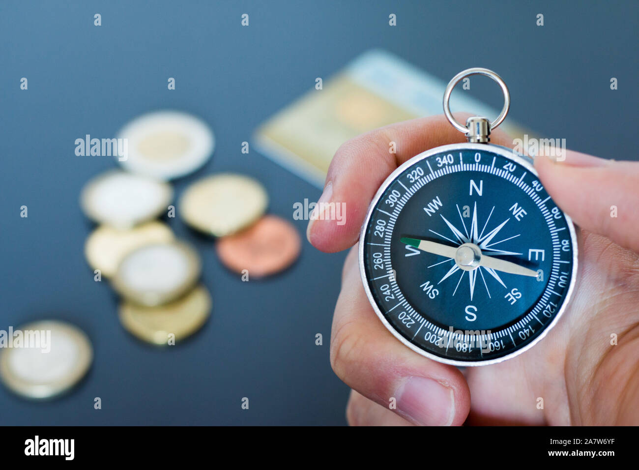 Closeup of a mans hand holding a compass in his hand. Concept for ...