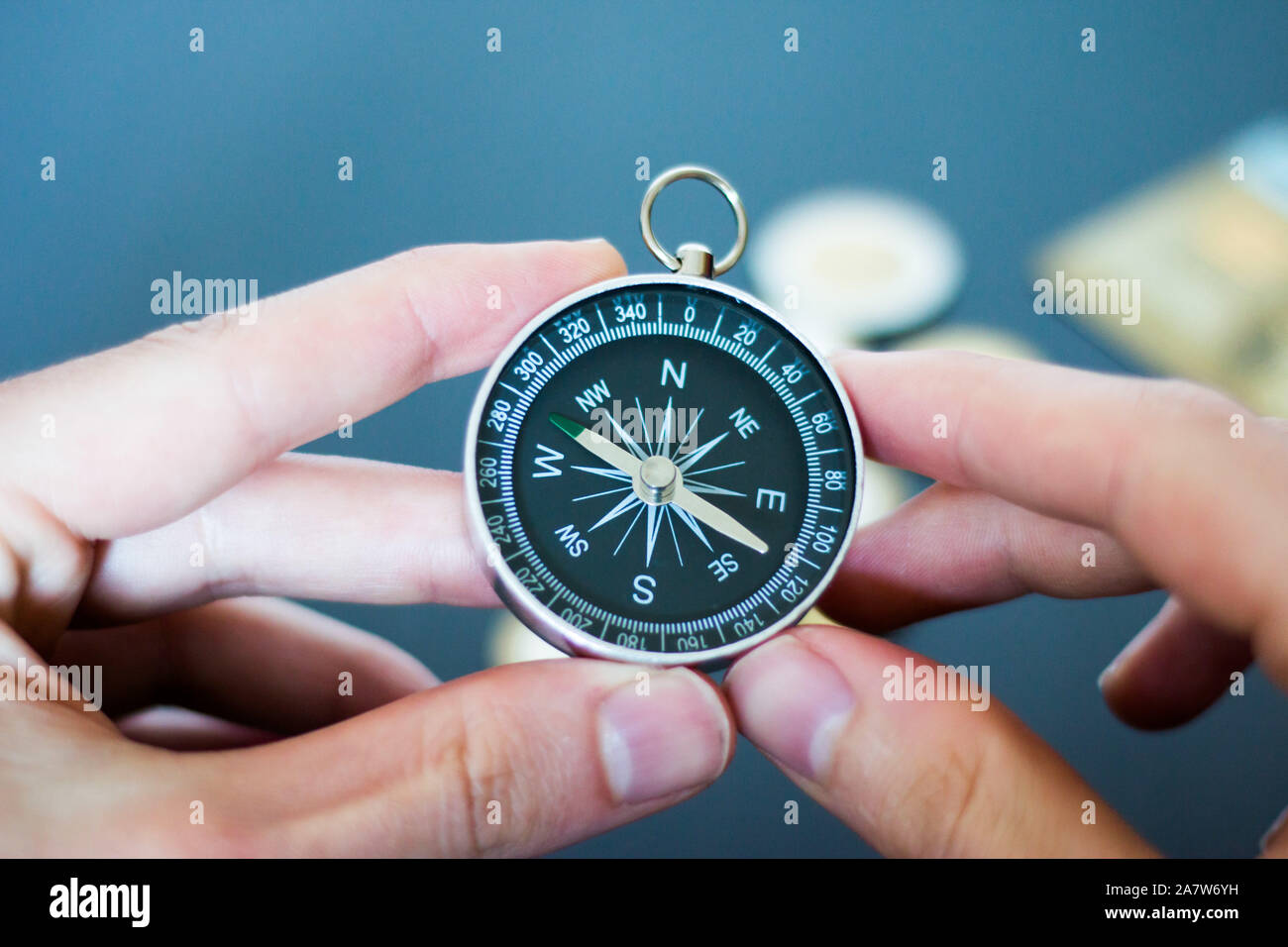 Closeup of a mans hand holding a compass in his hand. Concept for ...