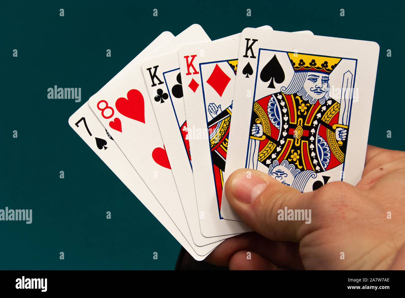 five different play cards in a hand Stock Photo - Alamy