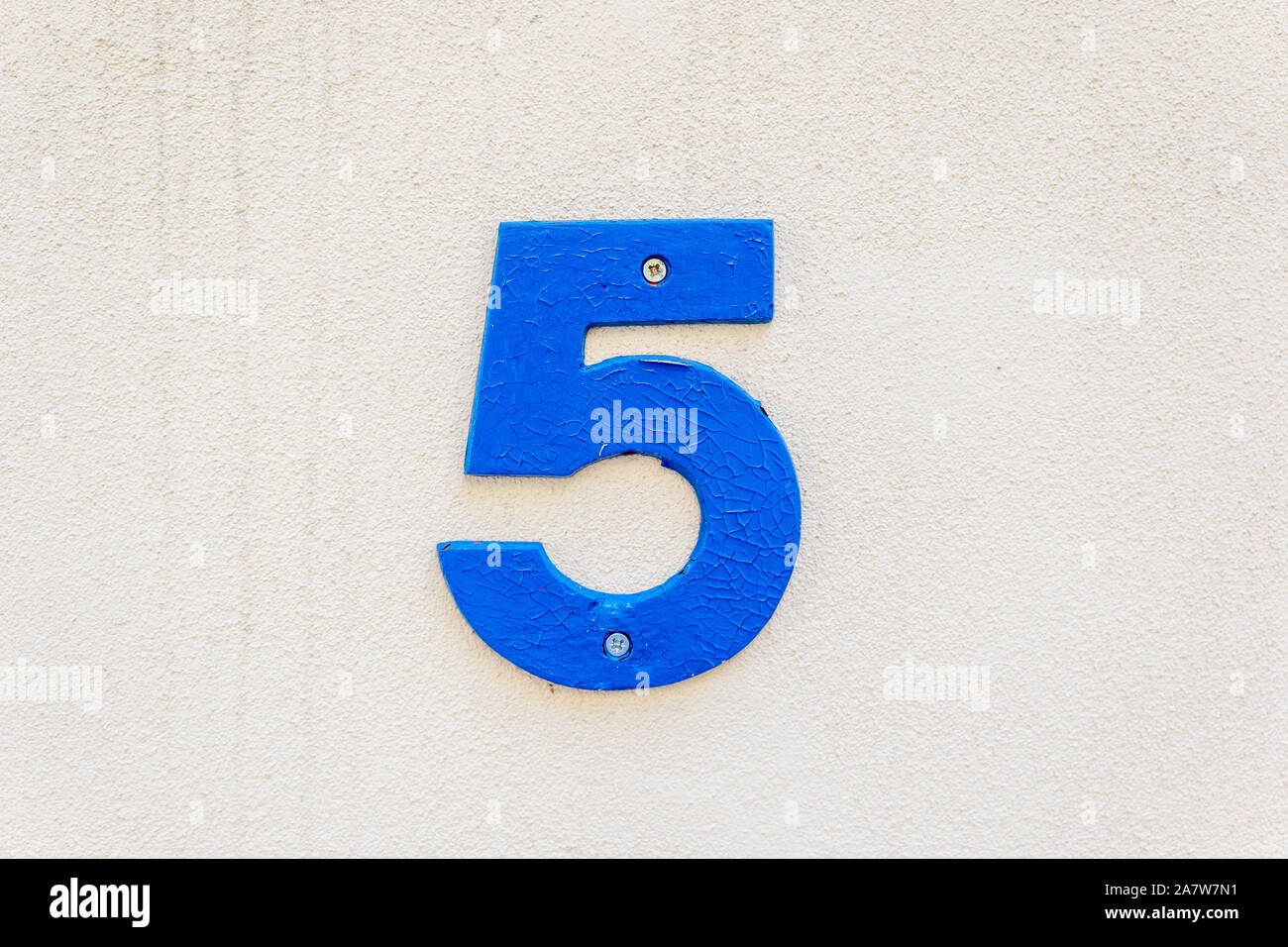 Street number sign on the wall Stock Photo - Alamy
