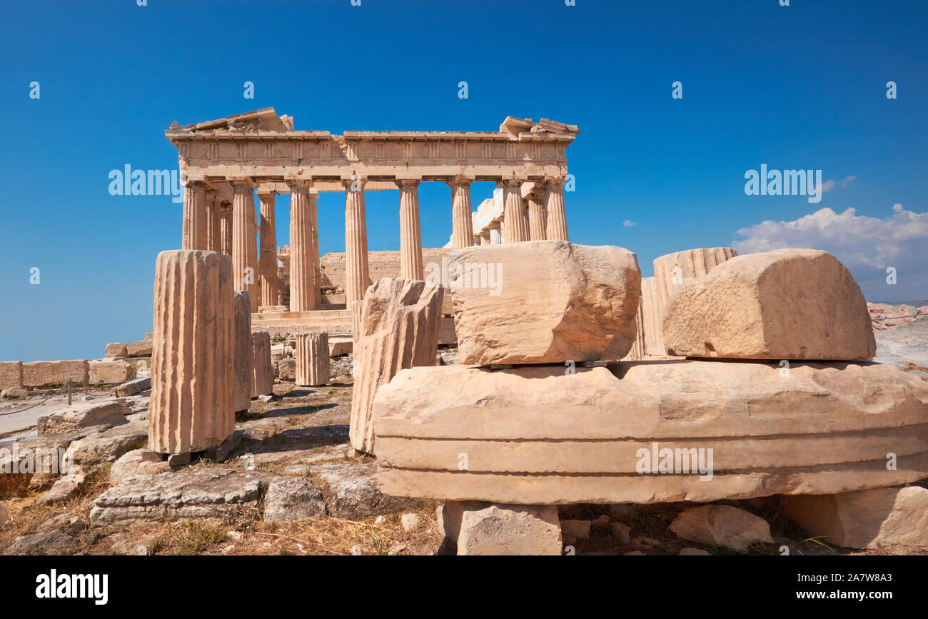 Parthenon temple on a bright day with blue sky. Panoramic image taken ...