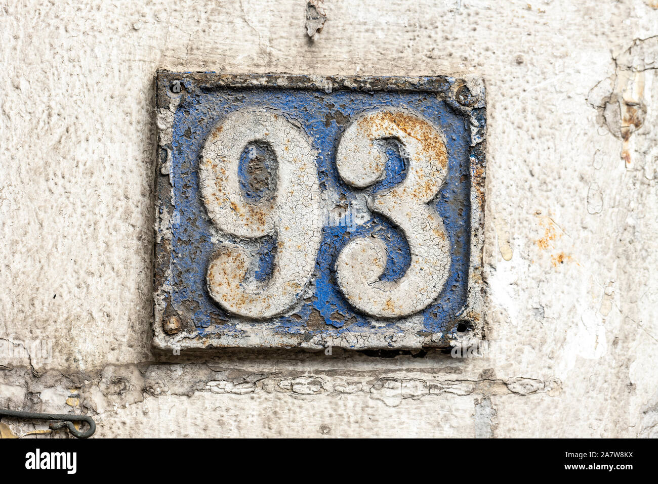 Street number sign on the wall Stock Photo - Alamy