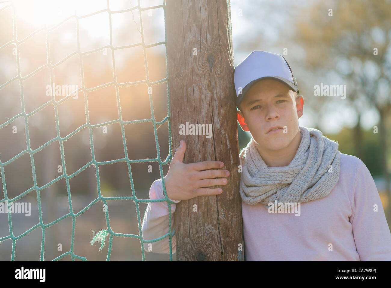 Portrait of a young handsome smiling man wearing a cap outdoors Stock ...