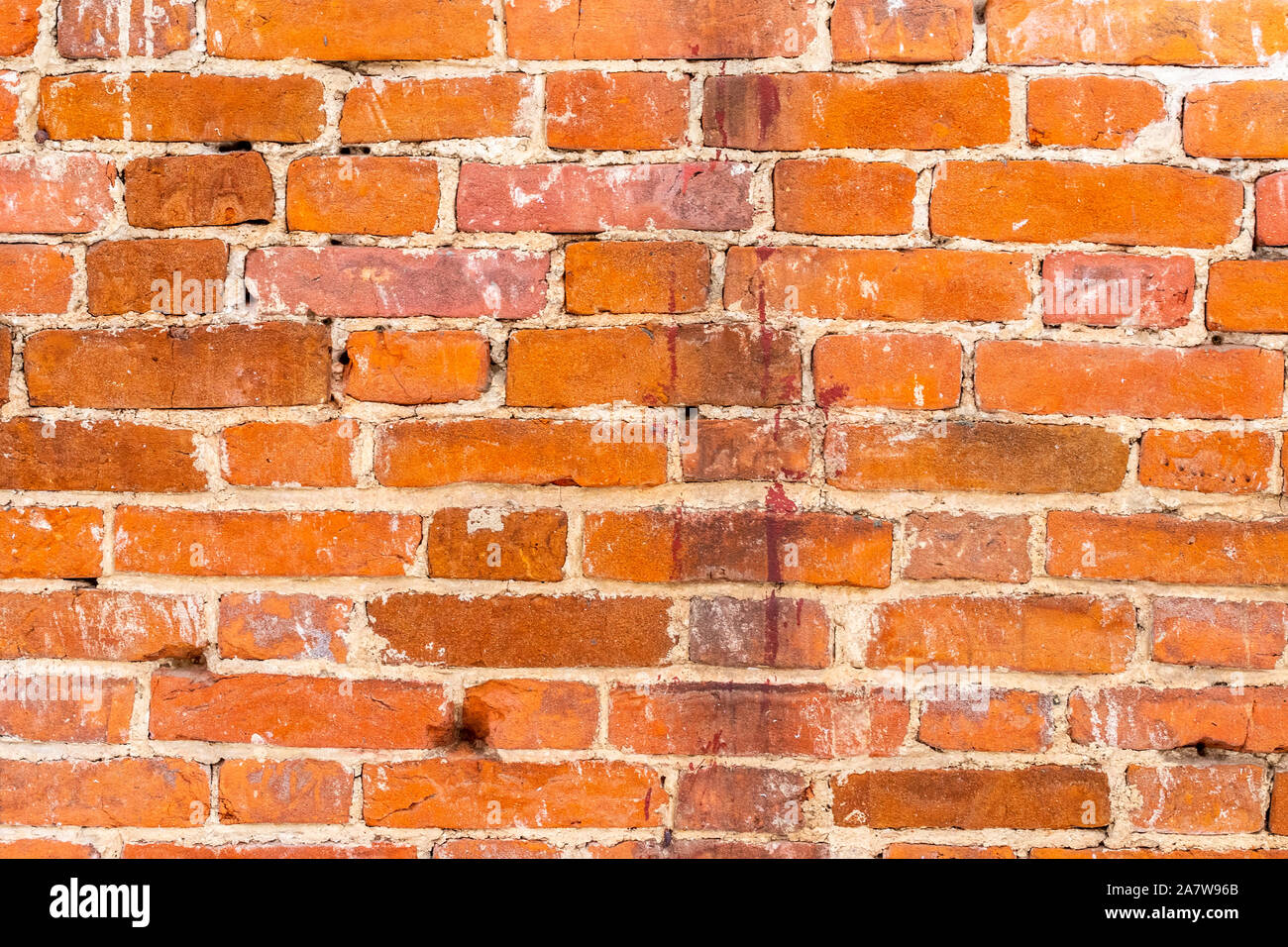 Background of old red stone wall. Texture of brick Stock Photo - Alamy