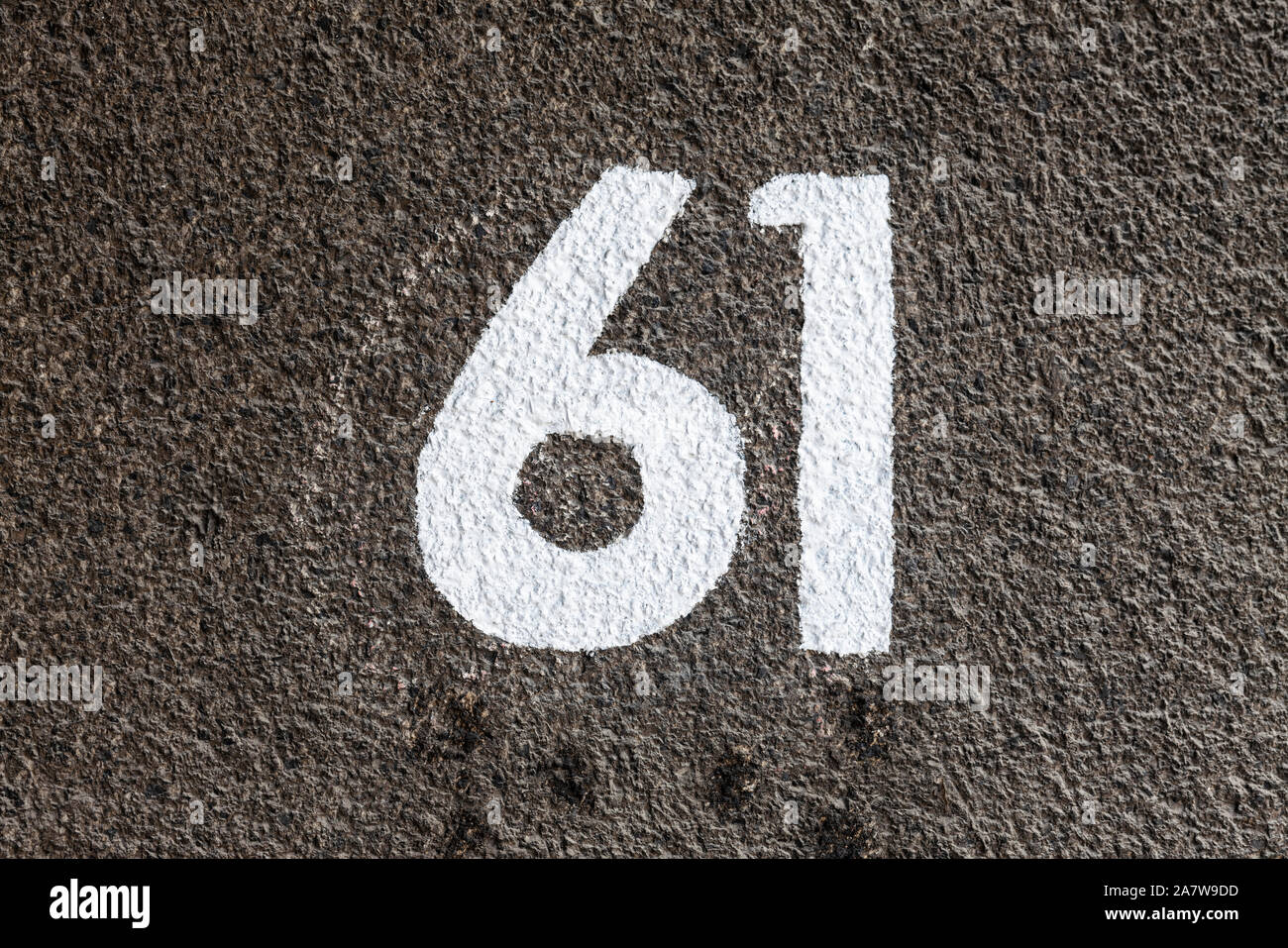 Street number sign on the wall Stock Photo - Alamy