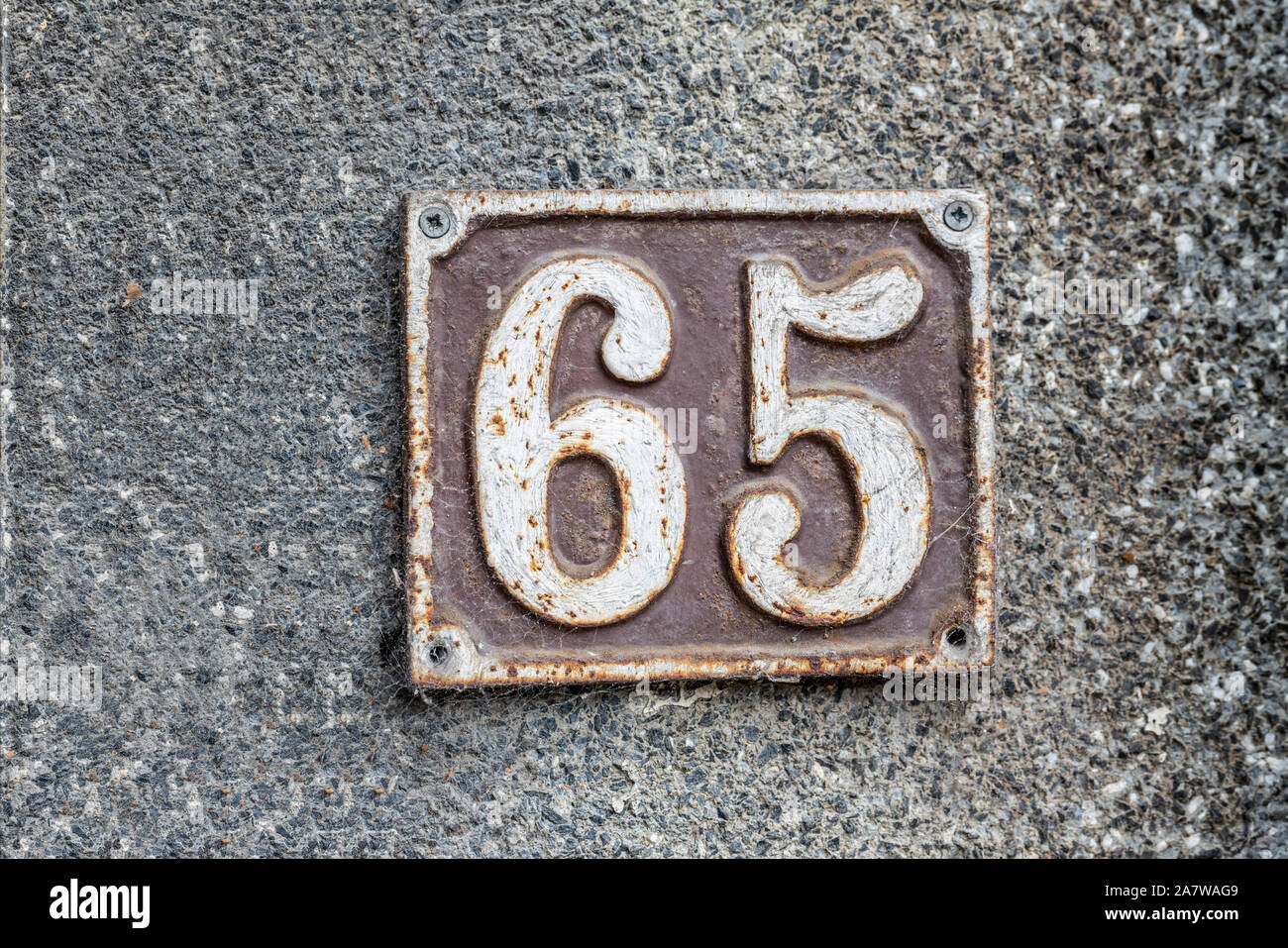 Street number sign on the wall Stock Photo - Alamy