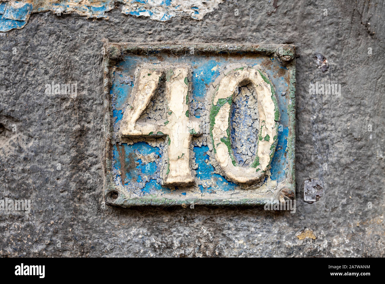 Street number sign on the wall Stock Photo - Alamy