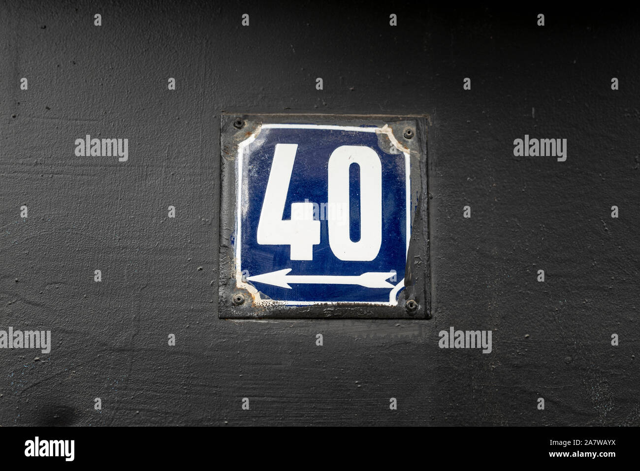 Street number sign on the wall Stock Photo - Alamy