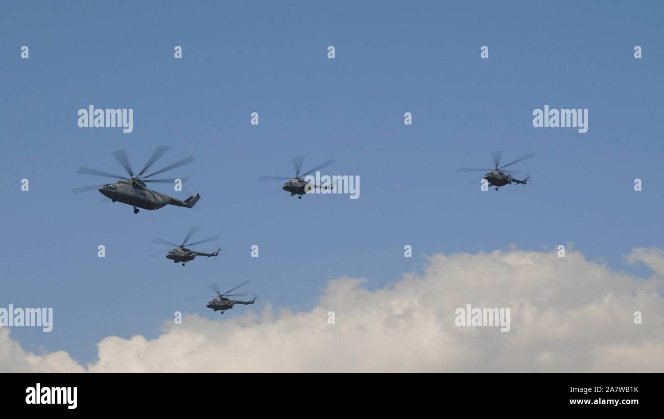 combat helicopters Mi-26 and Mi-8 fly in sky on training parade in ...