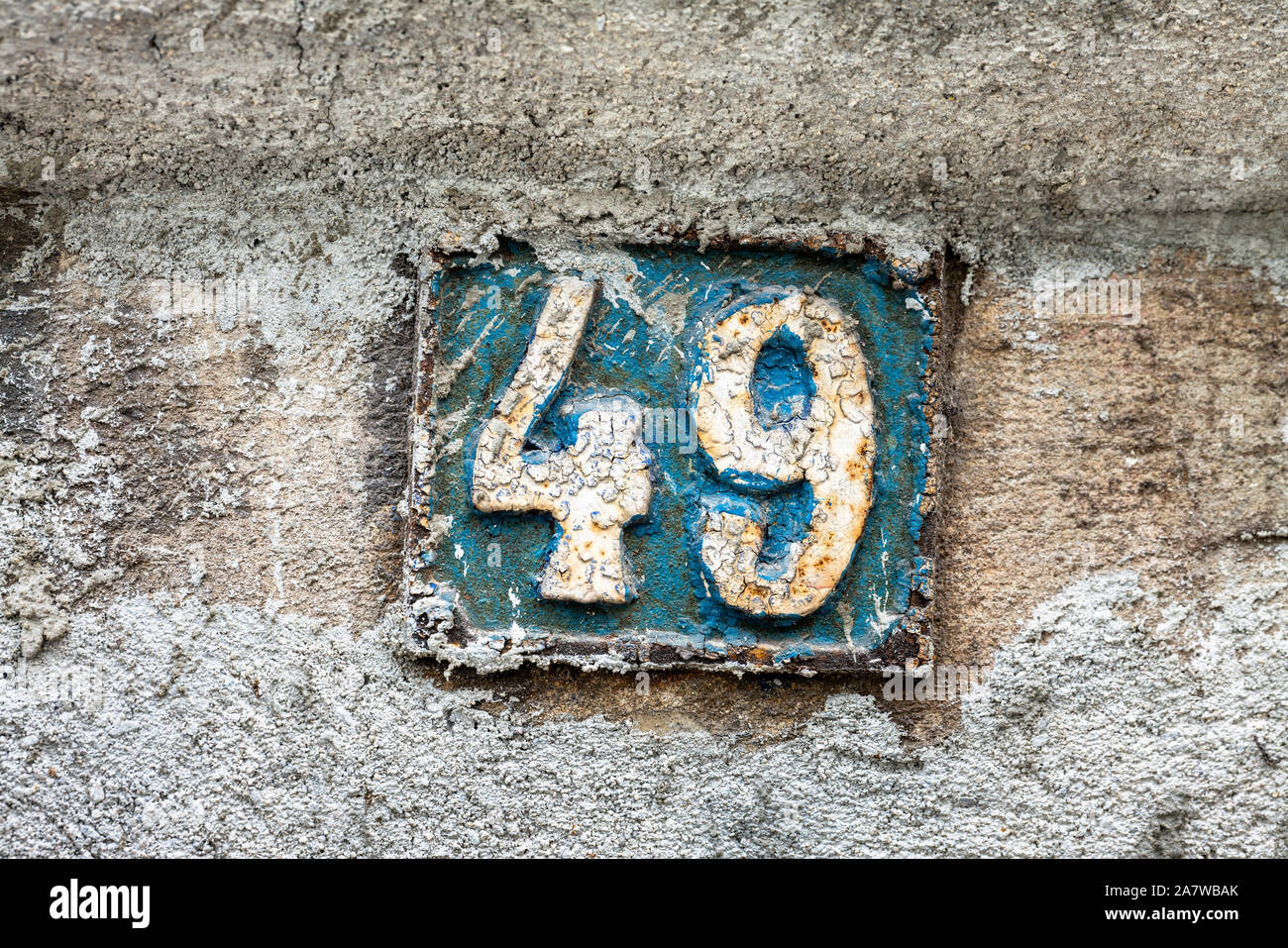 Street number sign on the wall Stock Photo - Alamy