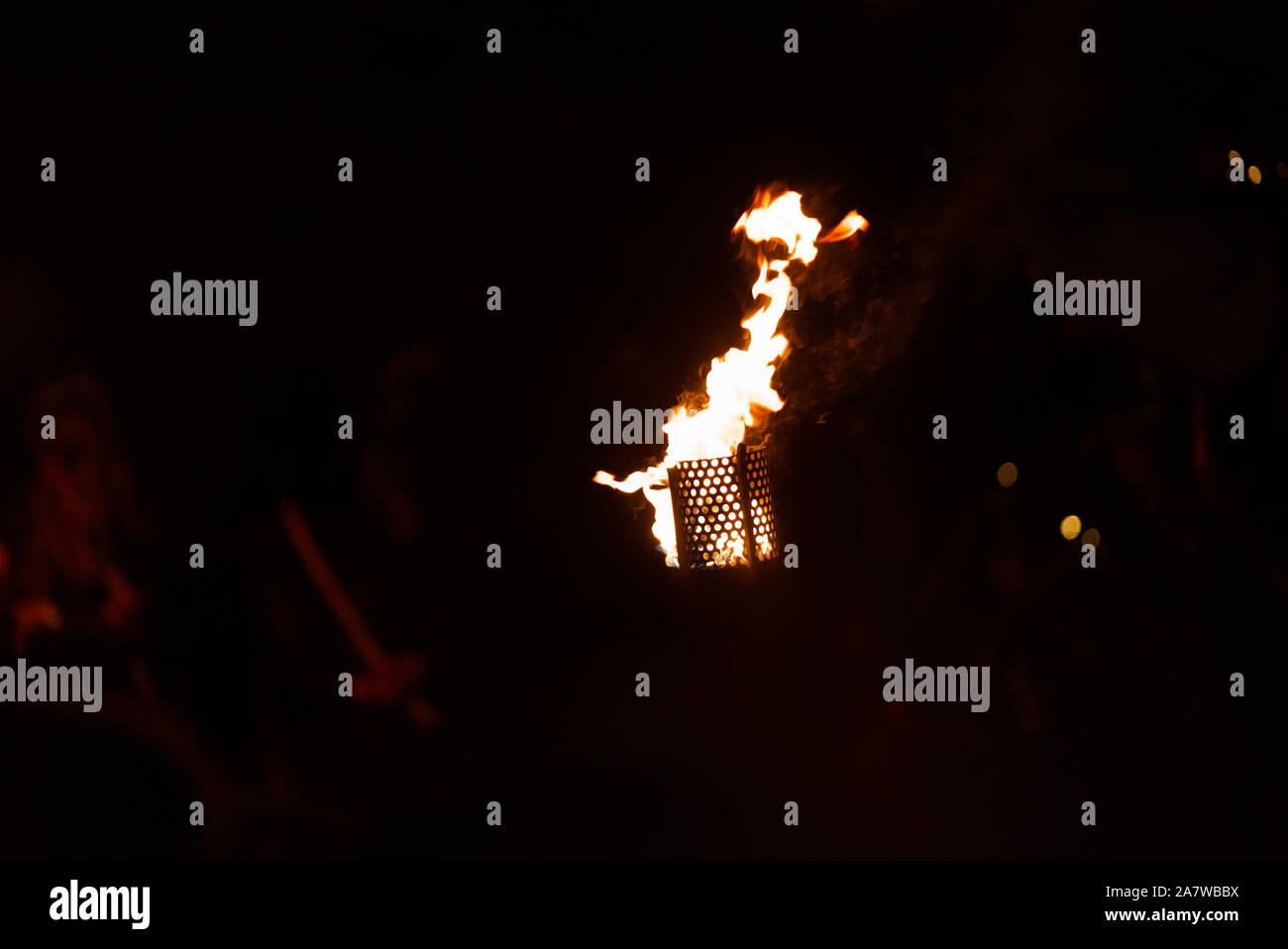 Orange torch flames with a dark night background. Spooky Halloween ...