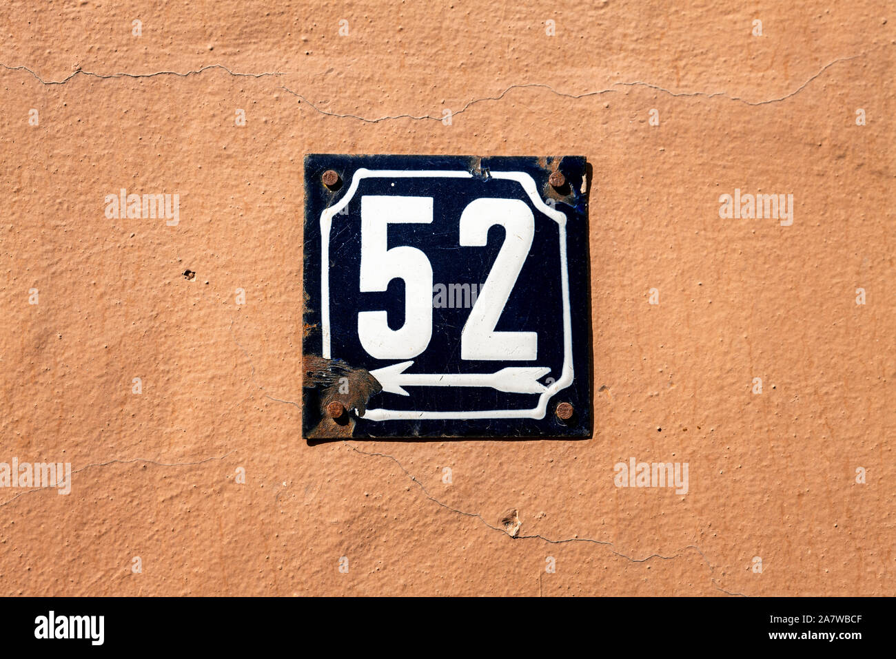 Street number sign on the wall Stock Photo - Alamy