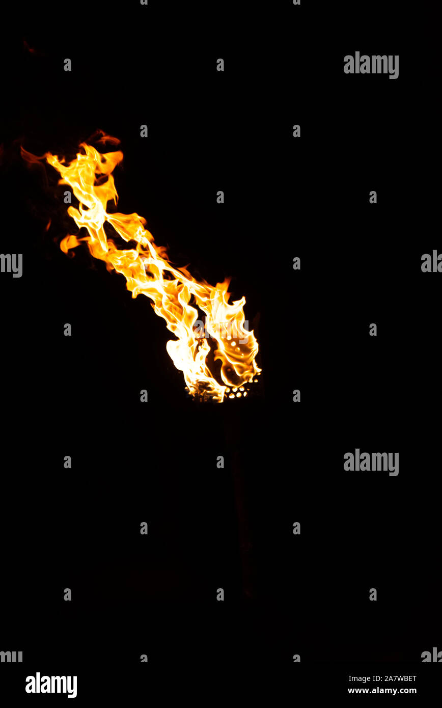 Orange torch flames with a dark night background. Spooky Halloween ...