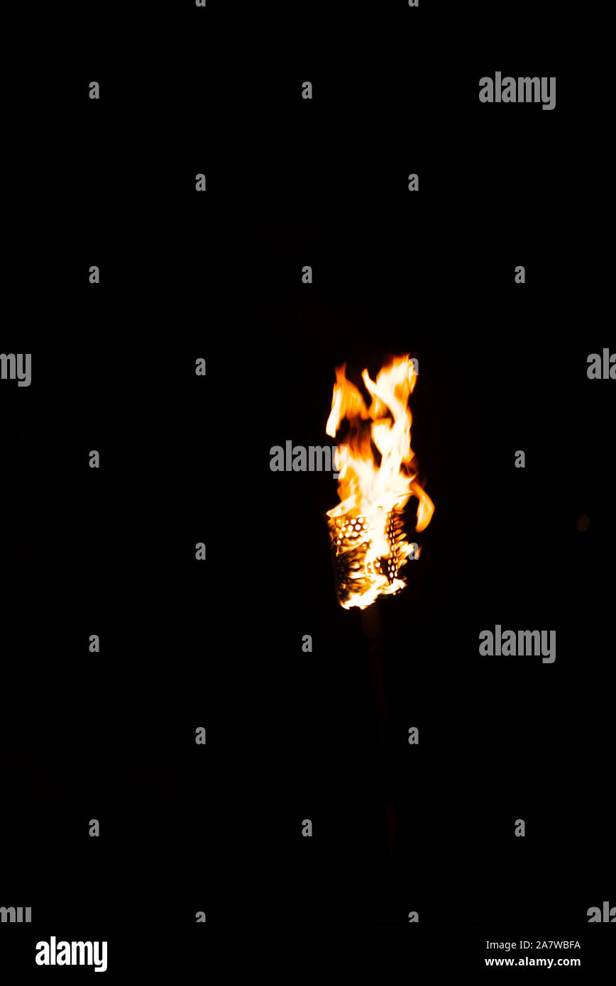 Orange torch flames with a dark night background. Spooky Halloween ...