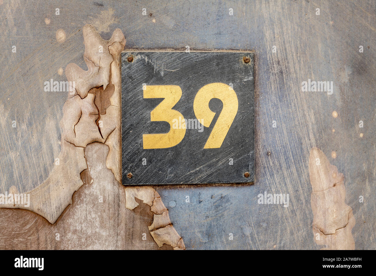 Street number sign on the wall Stock Photo - Alamy