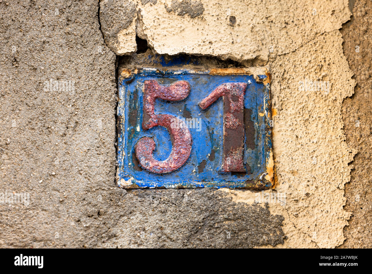 Street number sign on the wall Stock Photo - Alamy