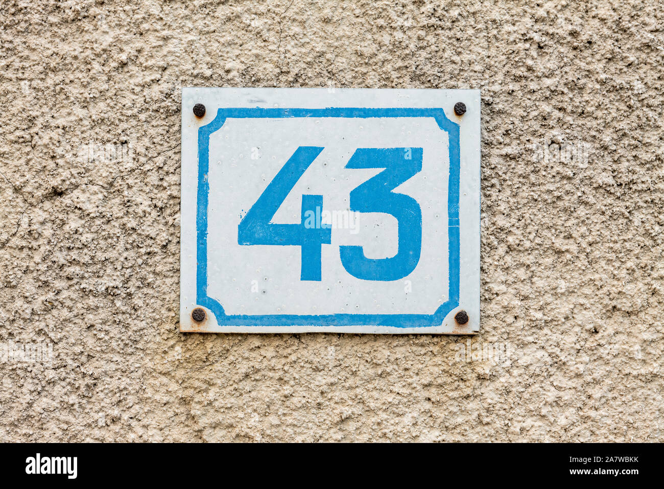 Street number sign on the wall Stock Photo - Alamy