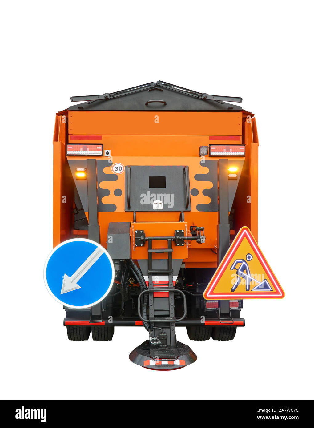 Rear of the orange street sweeper truck with road signs isolated on ...