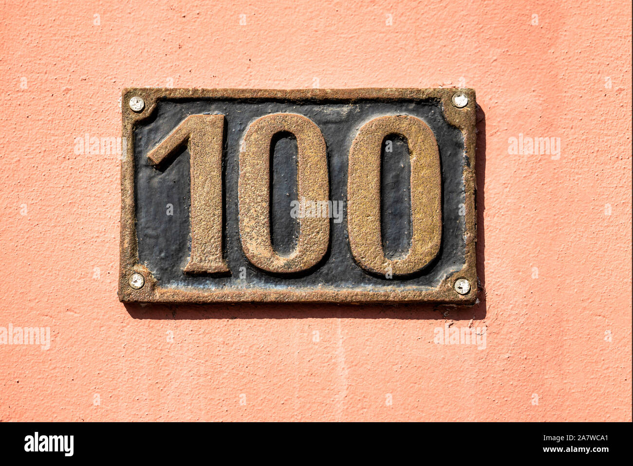 Street number sign on the wall Stock Photo - Alamy