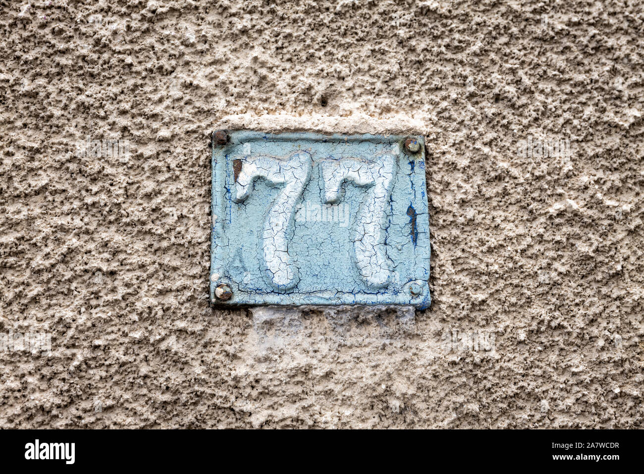 Street number sign on the wall Stock Photo - Alamy